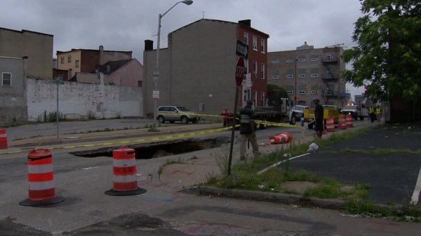 Giant sinkhole opens up in Baltimore street | 12newsnow.com
